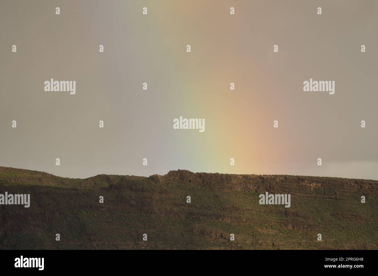 Rainbow over a ridge of the Tirajana crater Stock Photo - Alamy