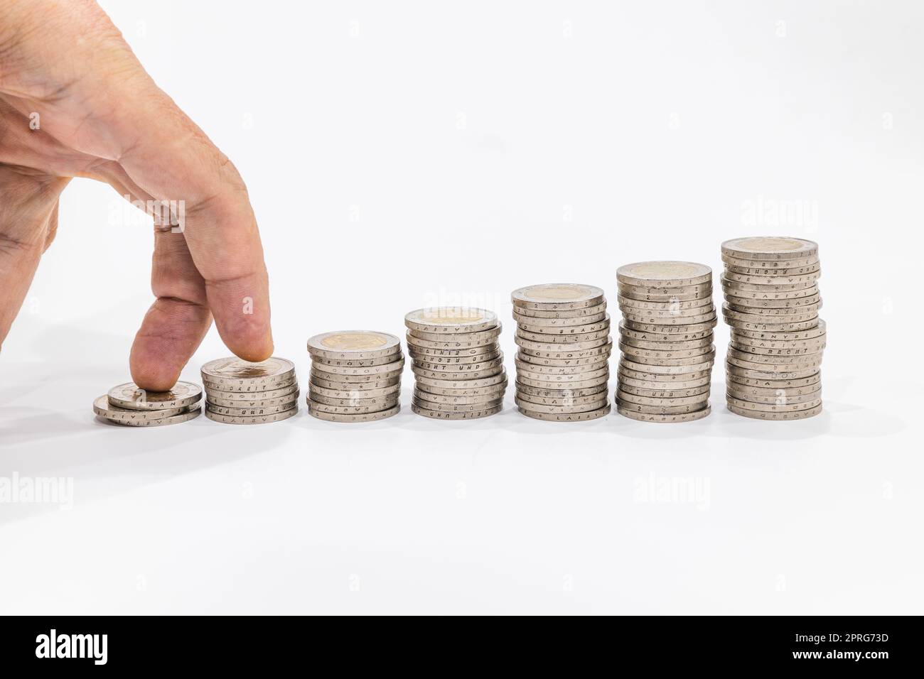 Fingers step on piles of coins in ascending order. Business and ...