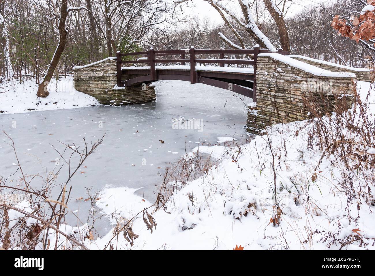Rustic Bridge Over Frozen River In Winter Stock Photo - Alamy