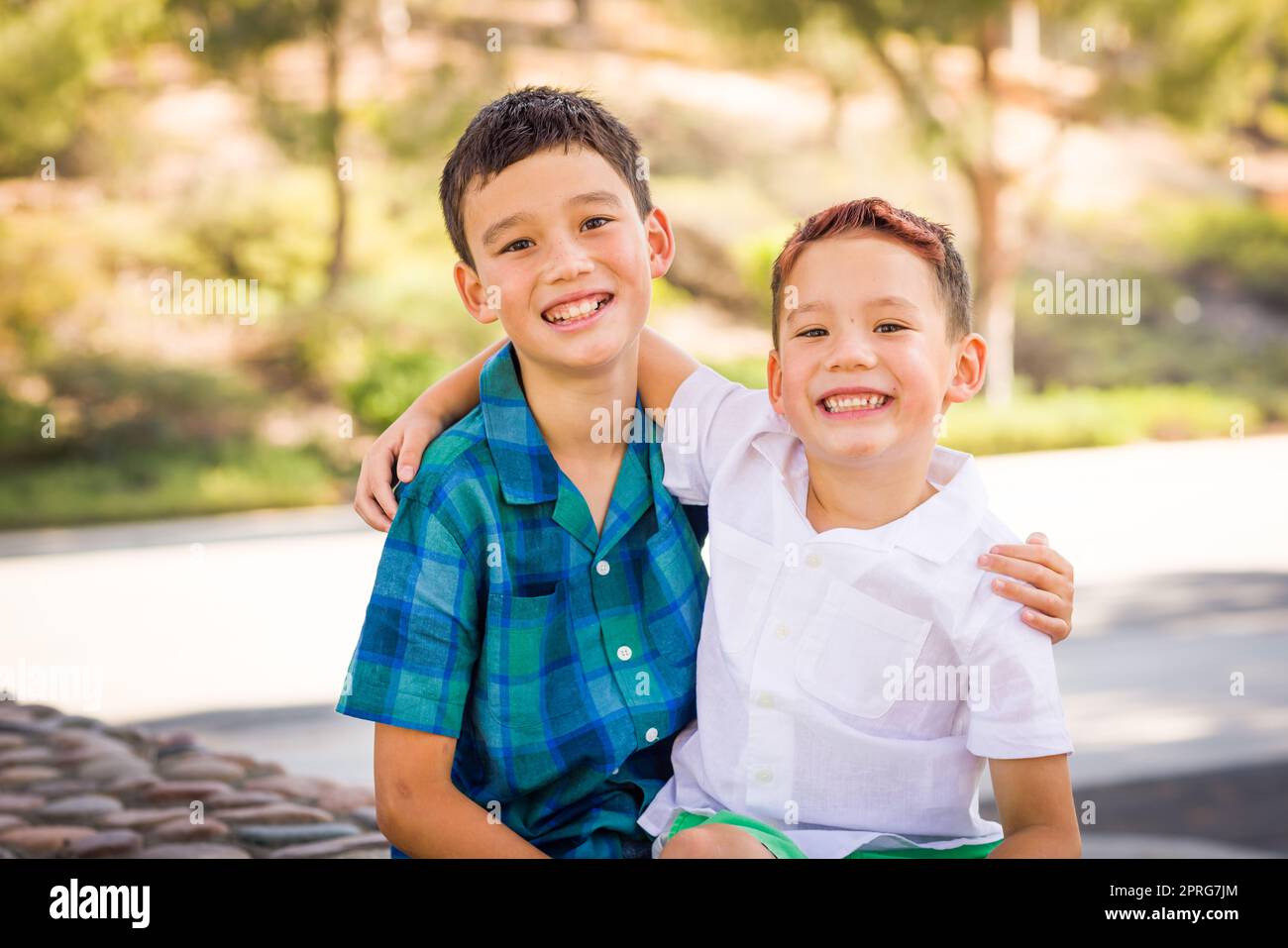 Outdoor portrait of biracial Chinese and Caucasian brothers Stock Photo ...