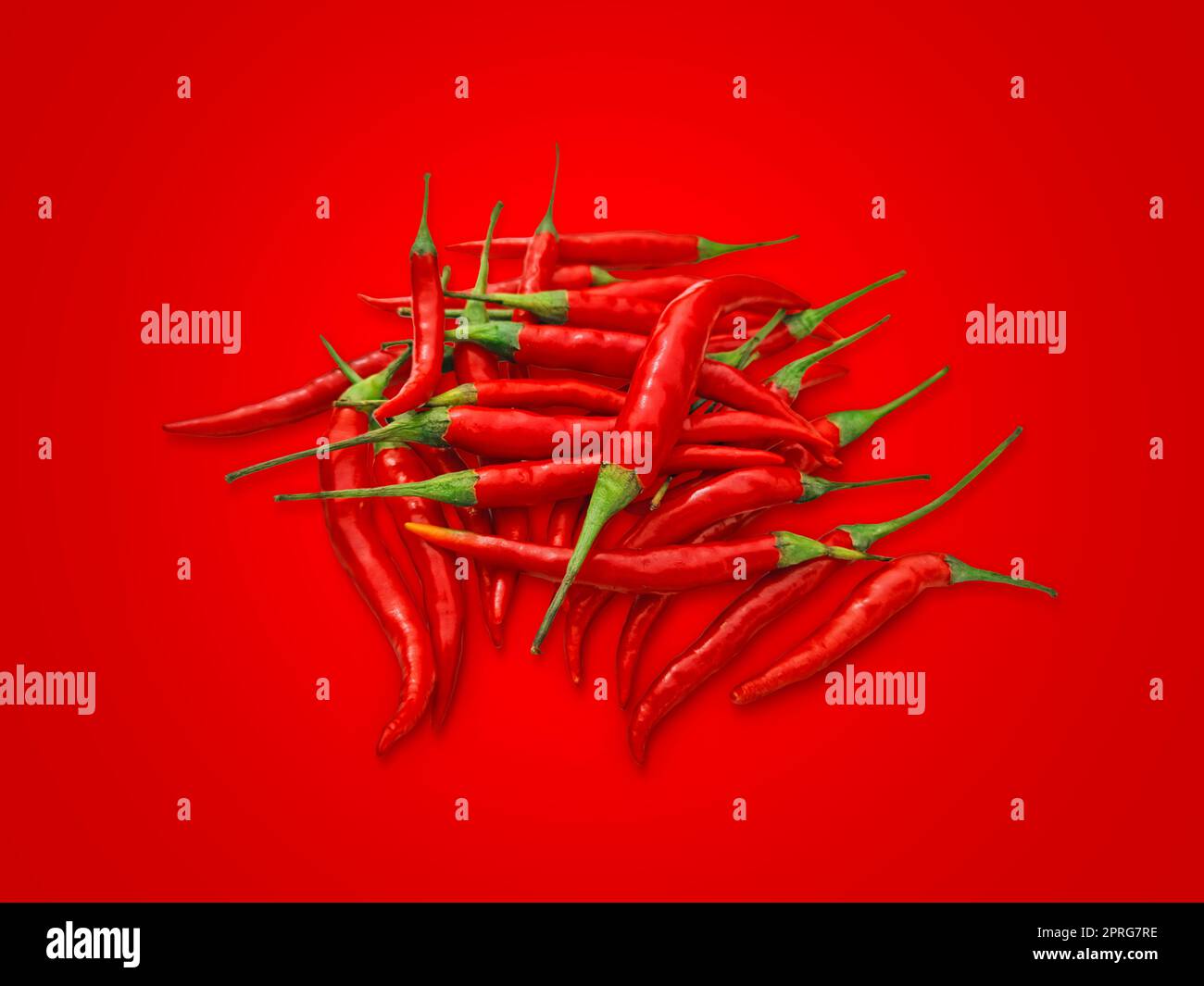 Fresh red chilli on red background Stock Photo - Alamy