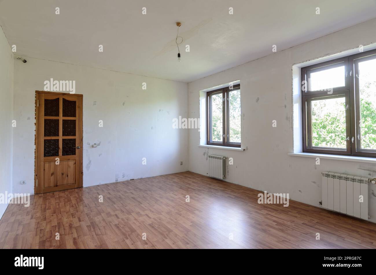 A fragment of a room with a fine finish, a view of the front door and ...