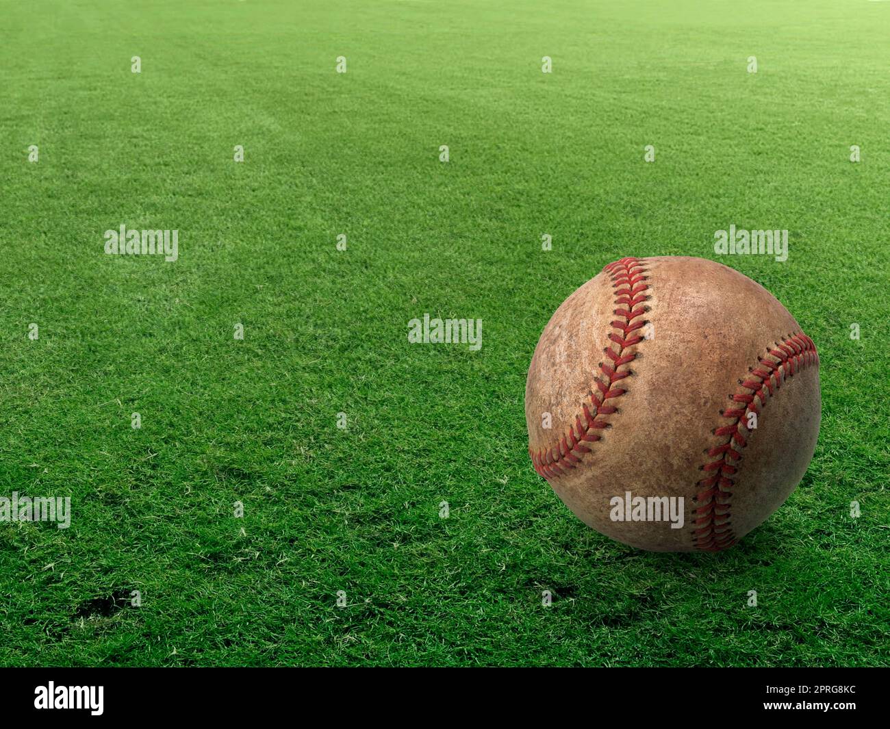 Baseball on the clear green grass turf close-up as macro shot with copy ...