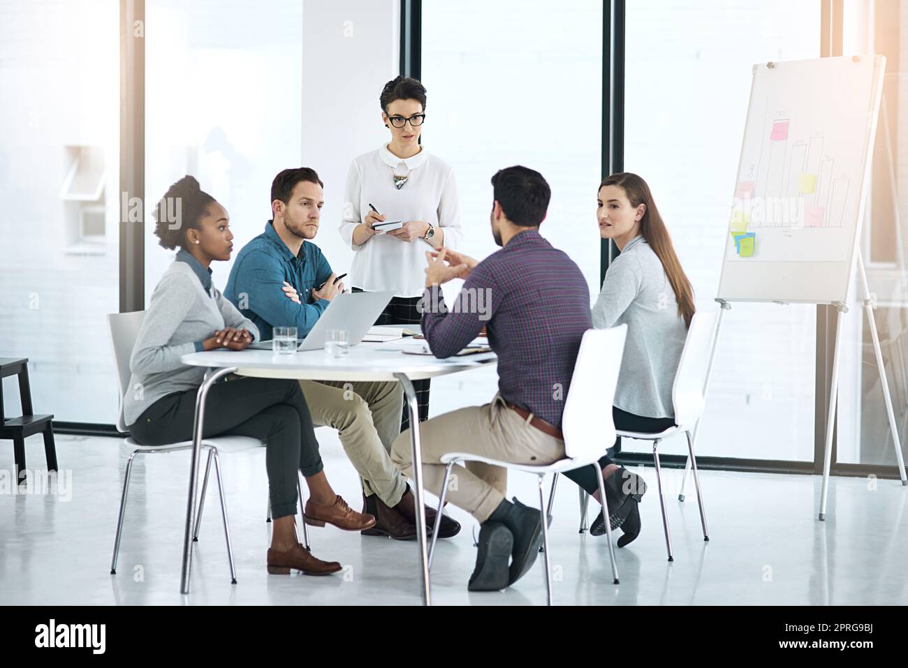 Making a note of the teams suggestions. a businesswoman giving a ...
