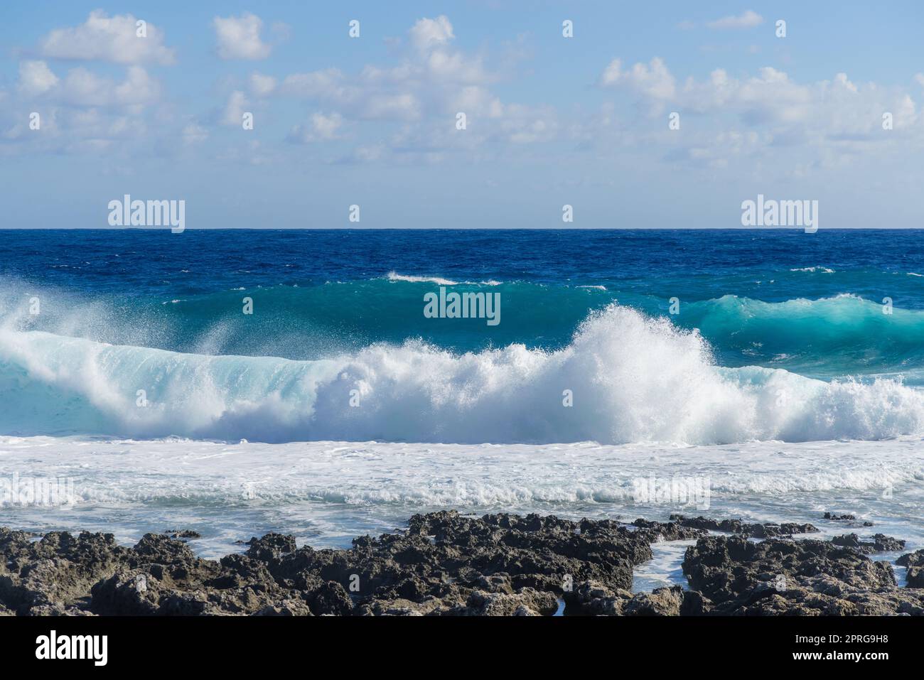 Big sea wave splash over the rock Stock Photo - Alamy