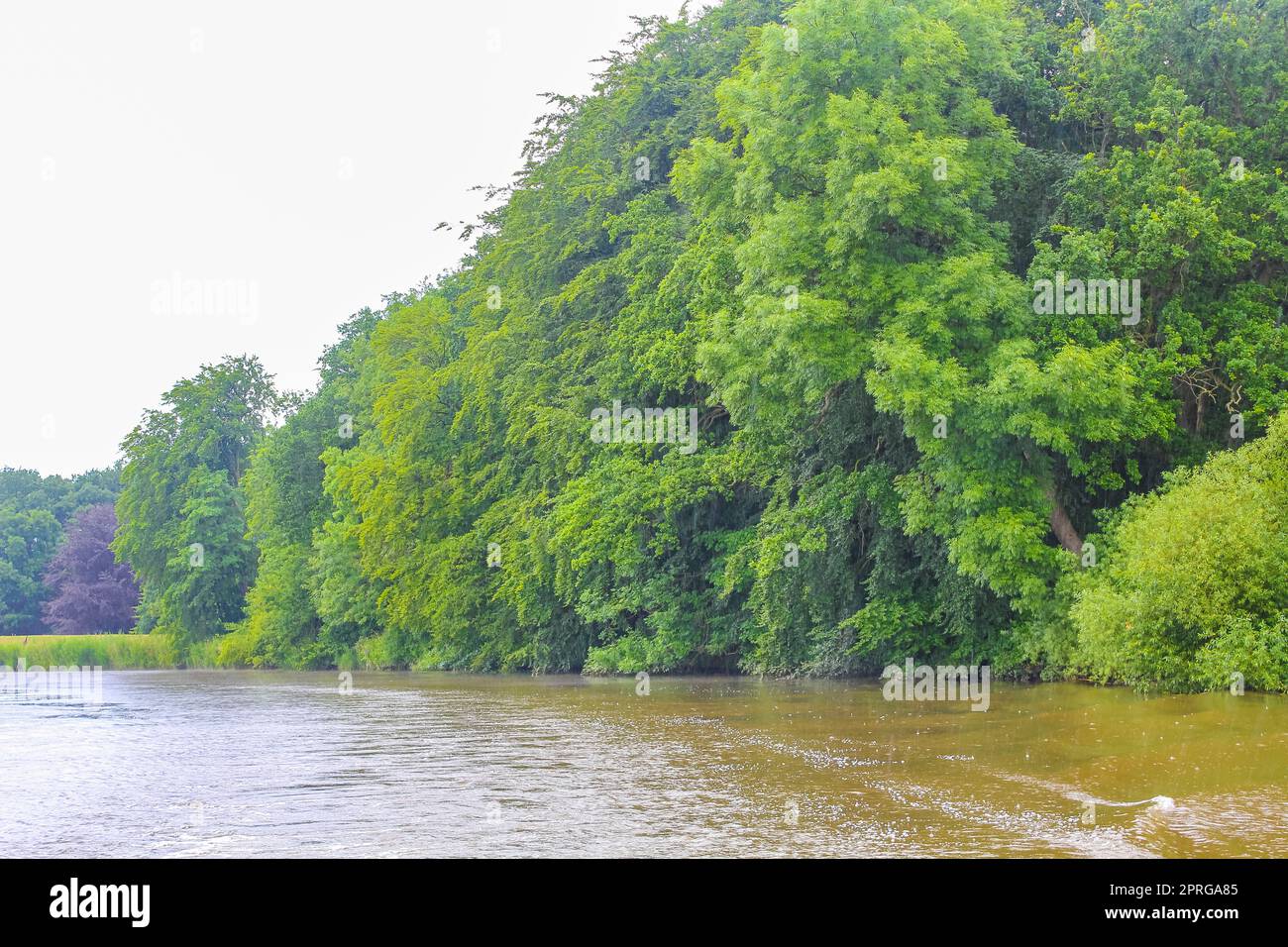 Heavy rain storm clouds wind waves water Oste river Germany Stock Photo ...