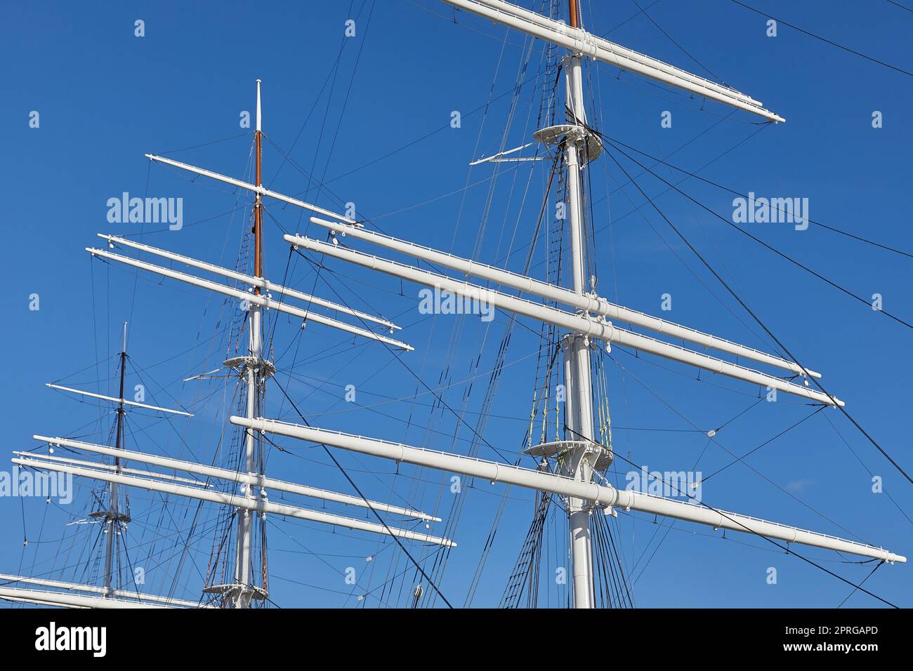 Ship masts in glowing highlights Stock Photo - Alamy