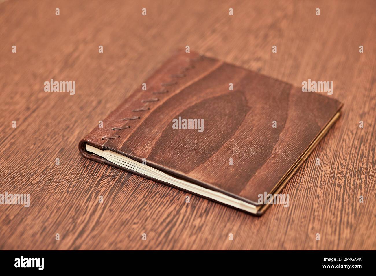 Note book with hard wooden cover Stock Photo - Alamy
