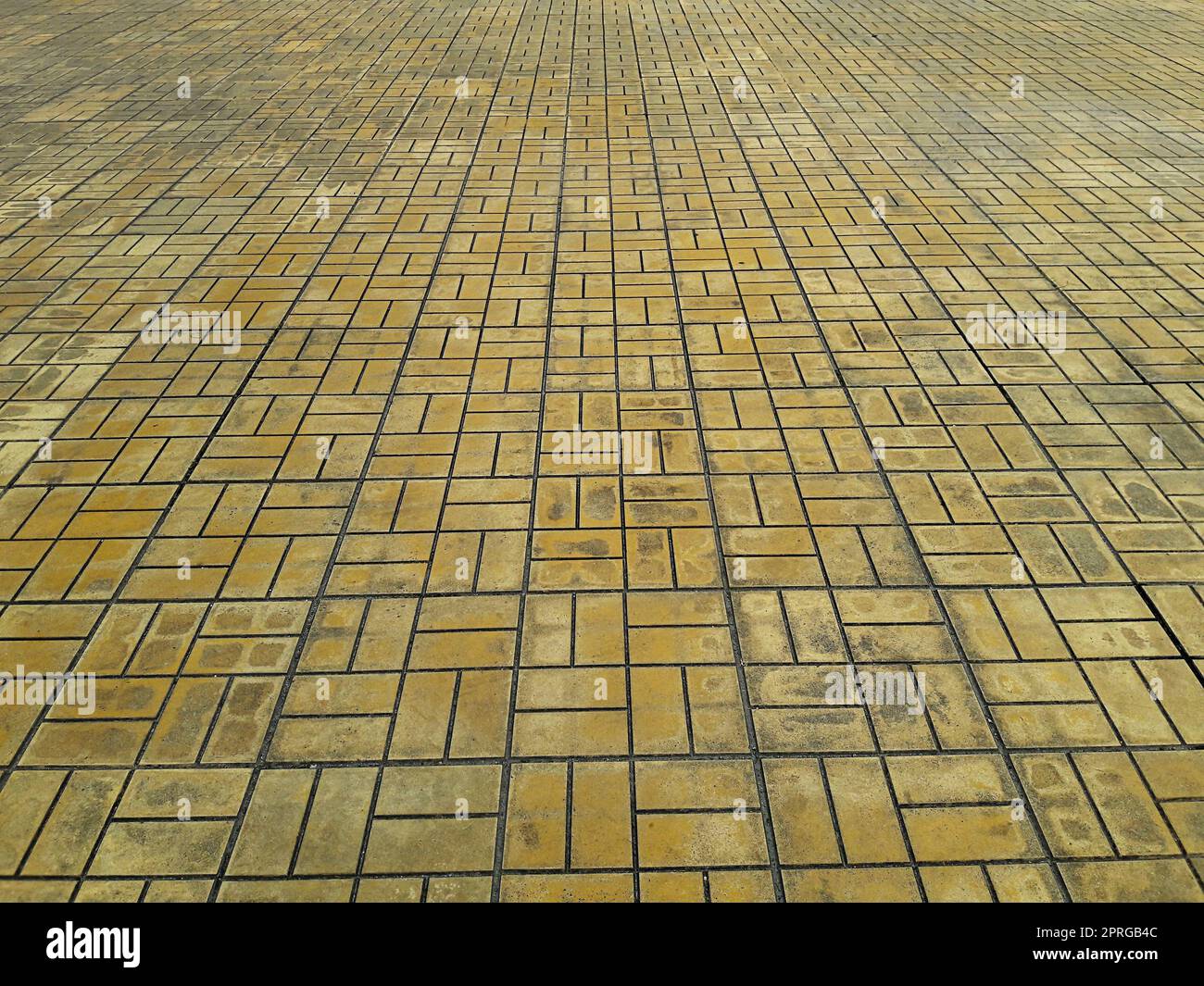 The pattern of tiles on the floor yellow cobblestone road Stock Photo ...