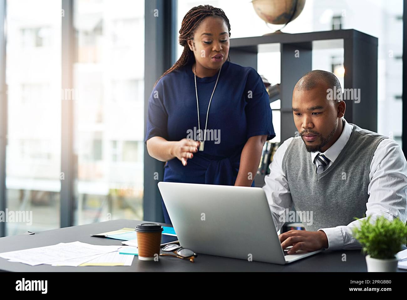 What are colleagues for. a young businesswoman assisting a male ...