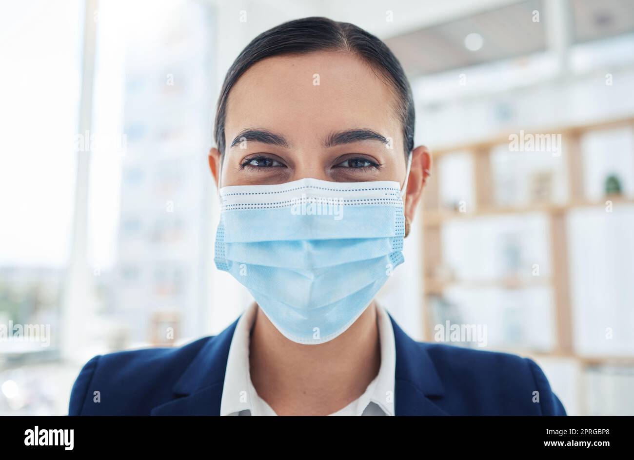 Safety, compliance and face mask covid regulations at work with a young ...