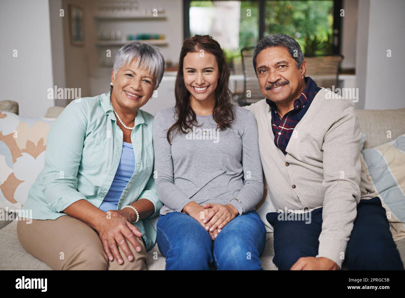 This one is for the family album. Family portrait of a young woman and her mature parents ...