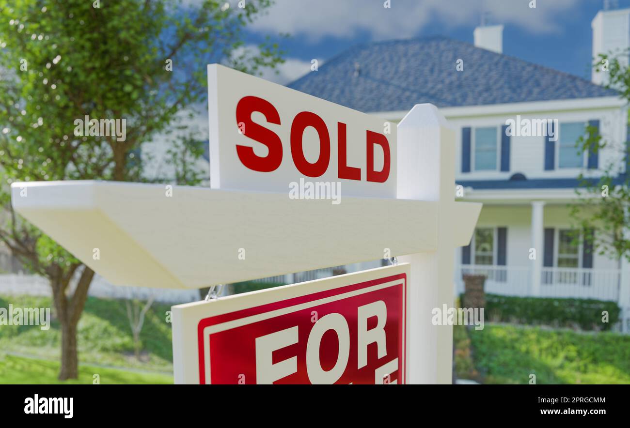 Close-up of Sold Placard On House For Sale Real Estate Sign In Front of ...