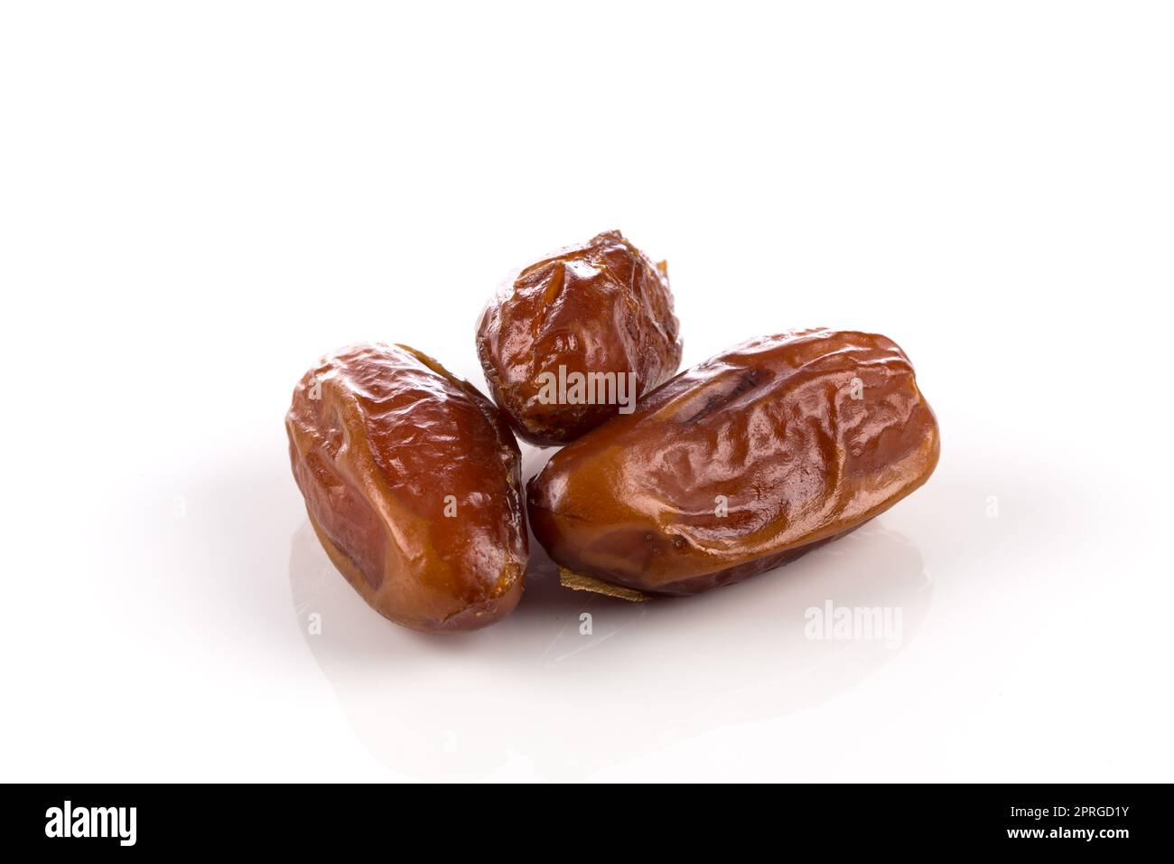 Date fruit close up isolated on white background Stock Photo - Alamy