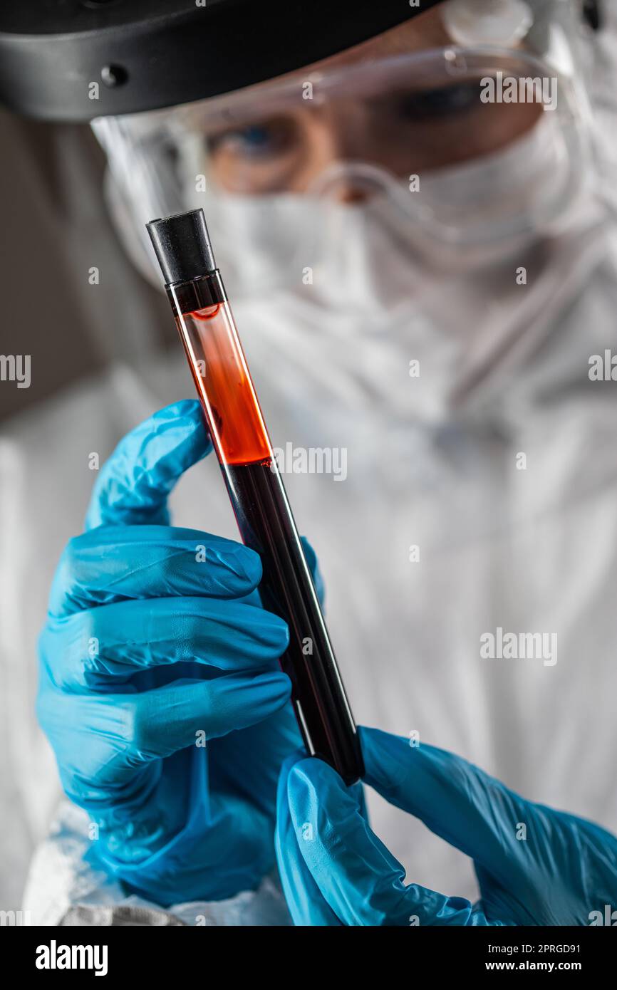 Female Lab Worker Holds Test Tube of Blood For Testing Stock Photo - Alamy
