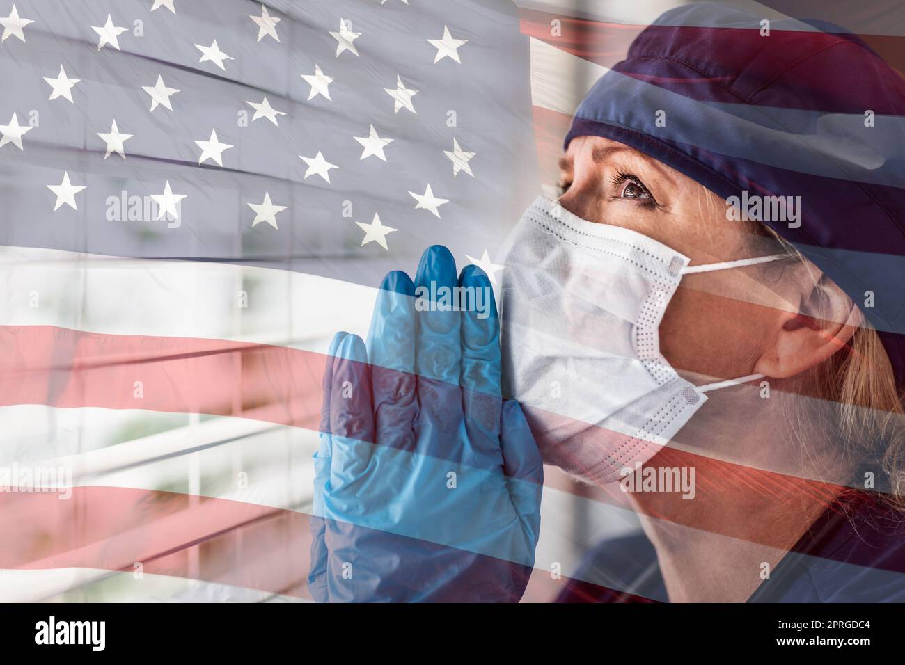 Prayerful Stressed Female Doctor or Nurse On Break At Window Wearing ...