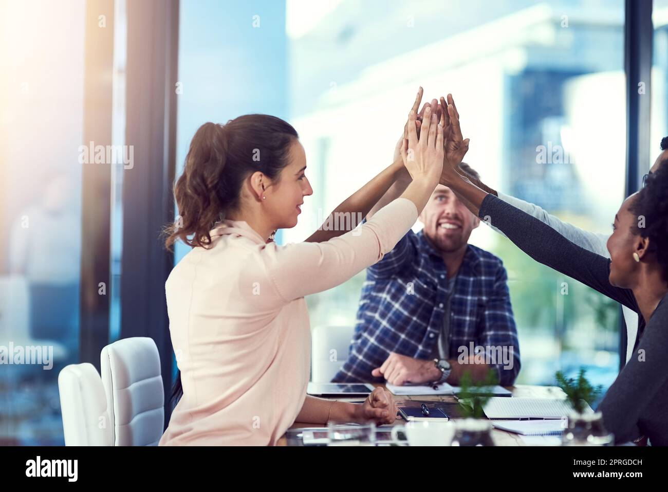 Business people high fiving in hi-res stock photography and images - Alamy