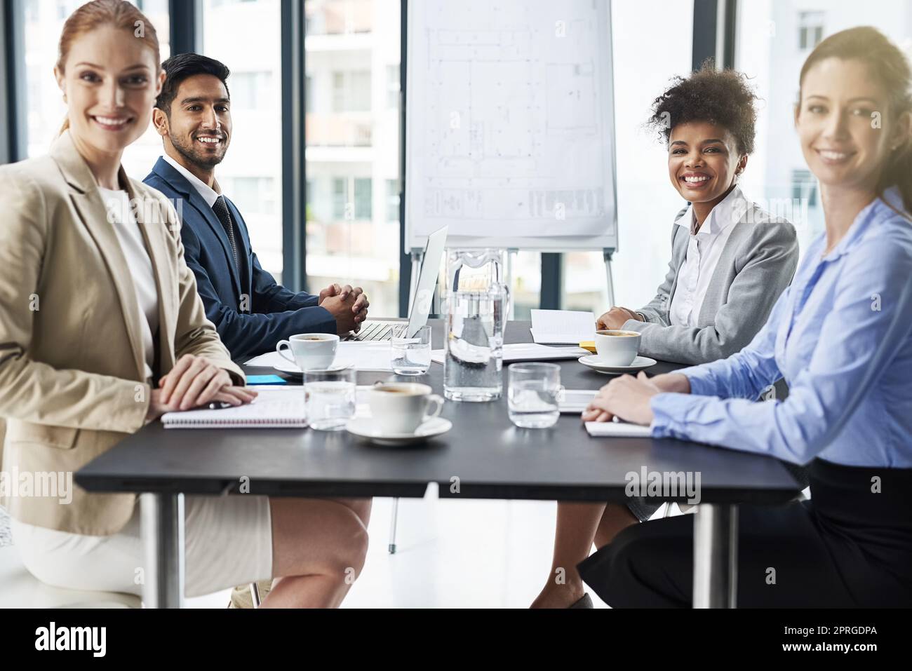 People seated around a table hi-res stock photography and images - Alamy