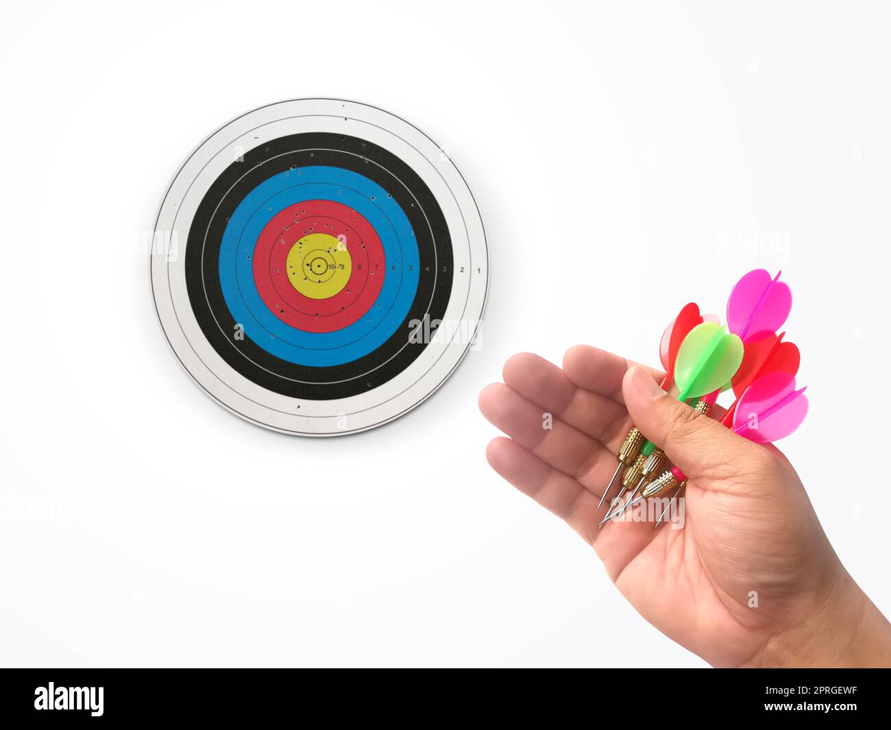 Human hand is throwing the darts target to the darts board. a man's ...