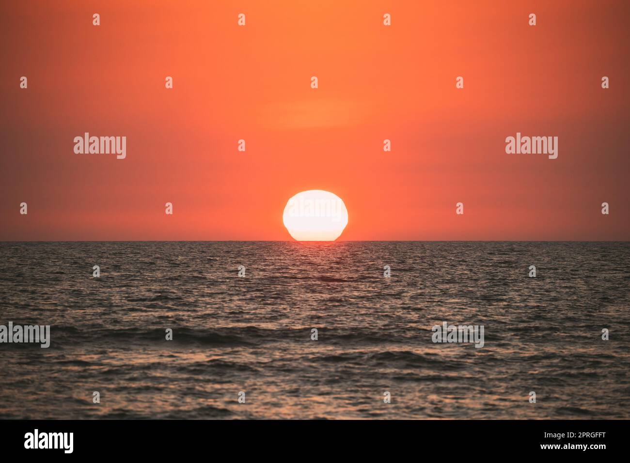 Natural Color Sunset Sunrise Sky Over Sea. Seascape With Shining ...