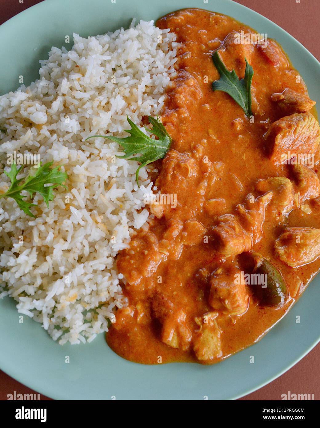 Chicken tikka masala and rice Stock Photo - Alamy