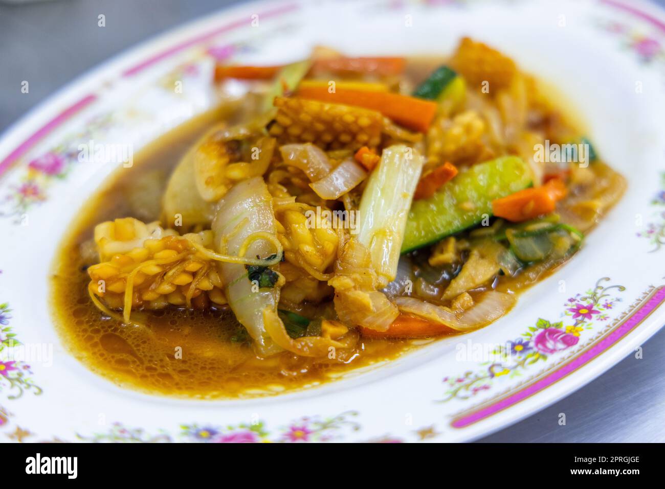 Fried squid dish in street market in Taiwan Stock Photo - Alamy