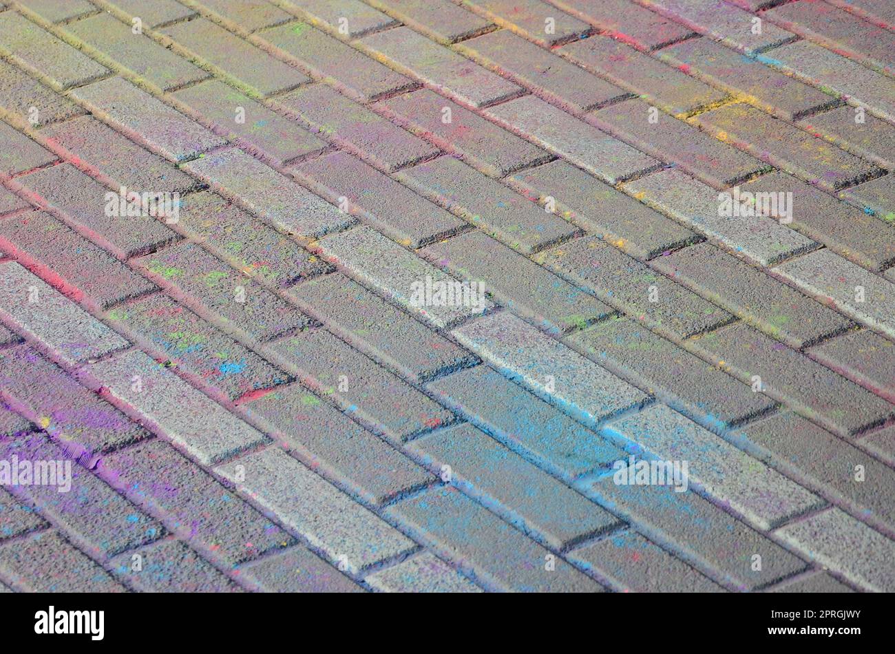 Multi colored earth, paving slabs, powder coated with dry colors at the ...
