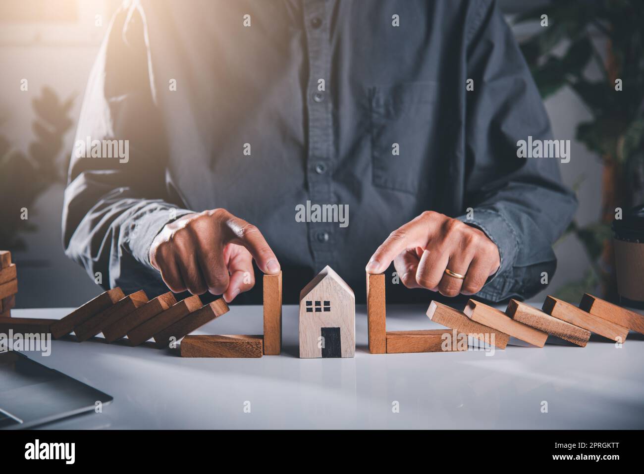 Business risk plan real estate protection. Man hand blocks wood block ...