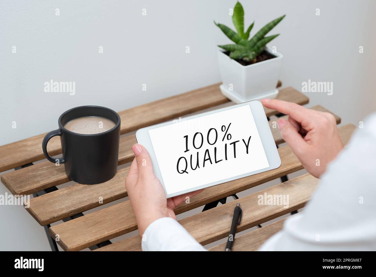 Woman holding table marked hi-res stock photography and images - Alamy