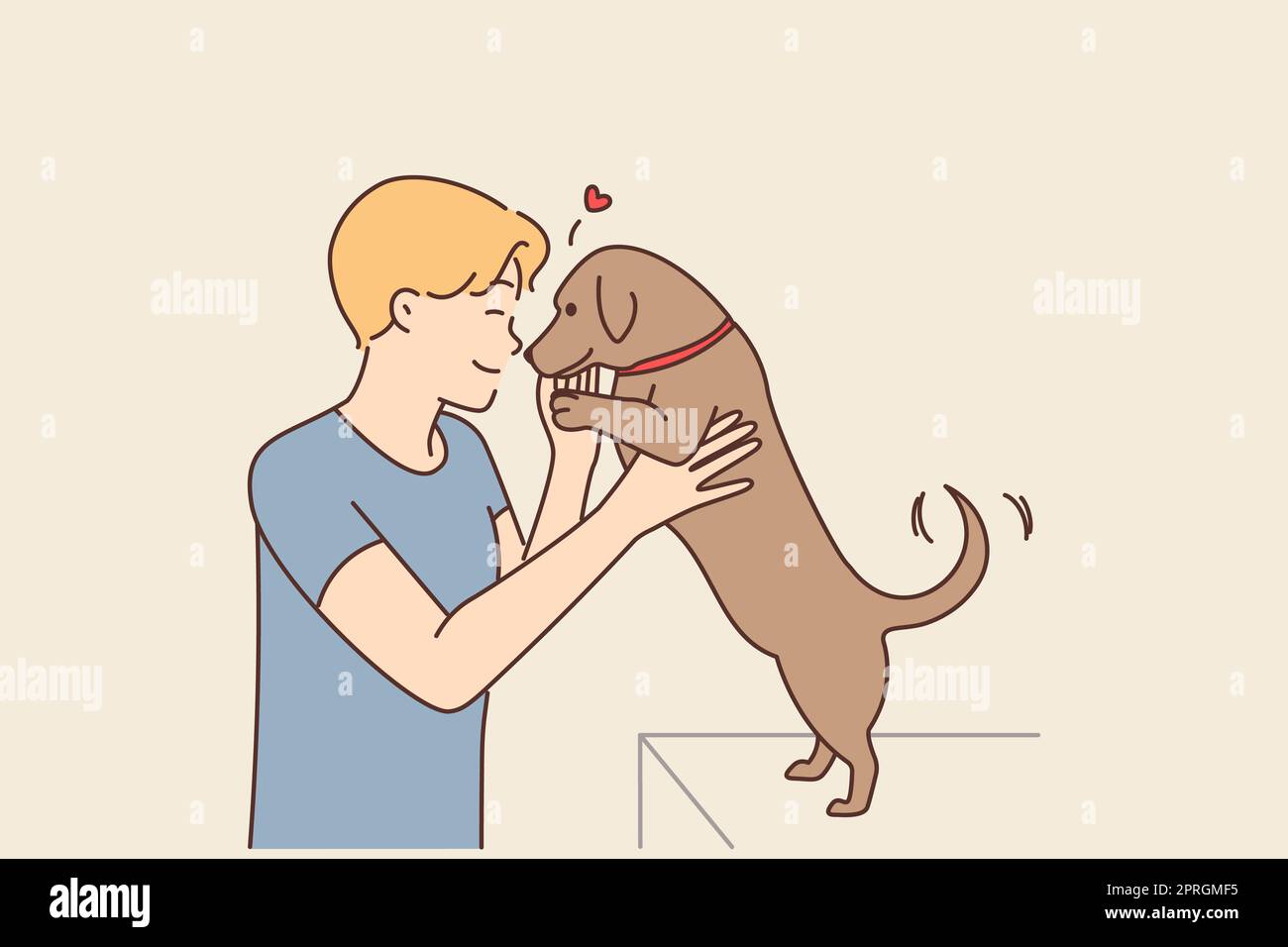 Happy guy playing with small puppy indoors. Smiling young man hug and ...