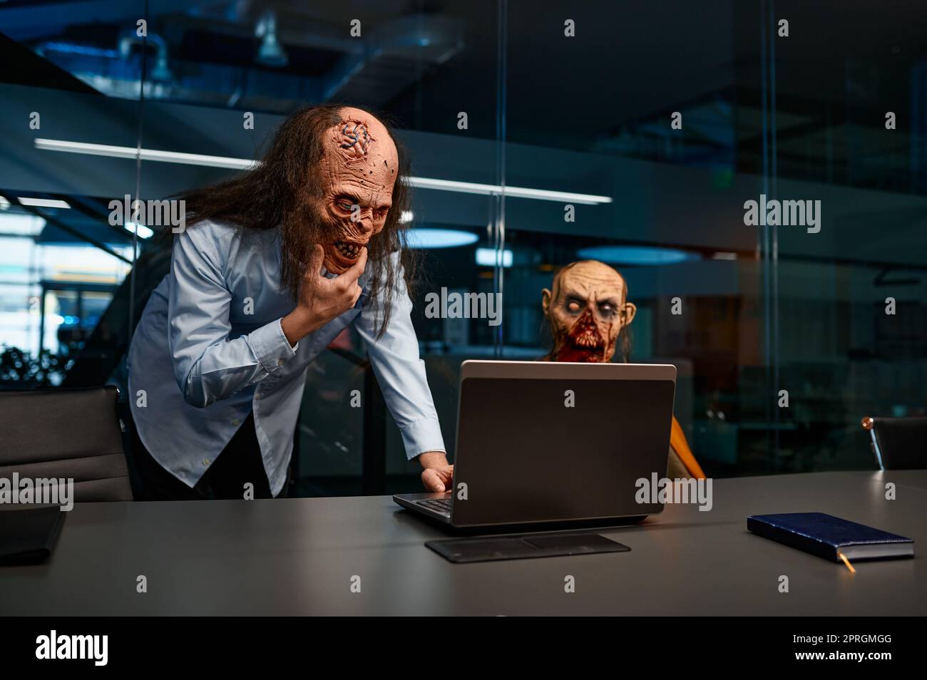 Zombie employees looking laptop and talking in night office. Undead ...