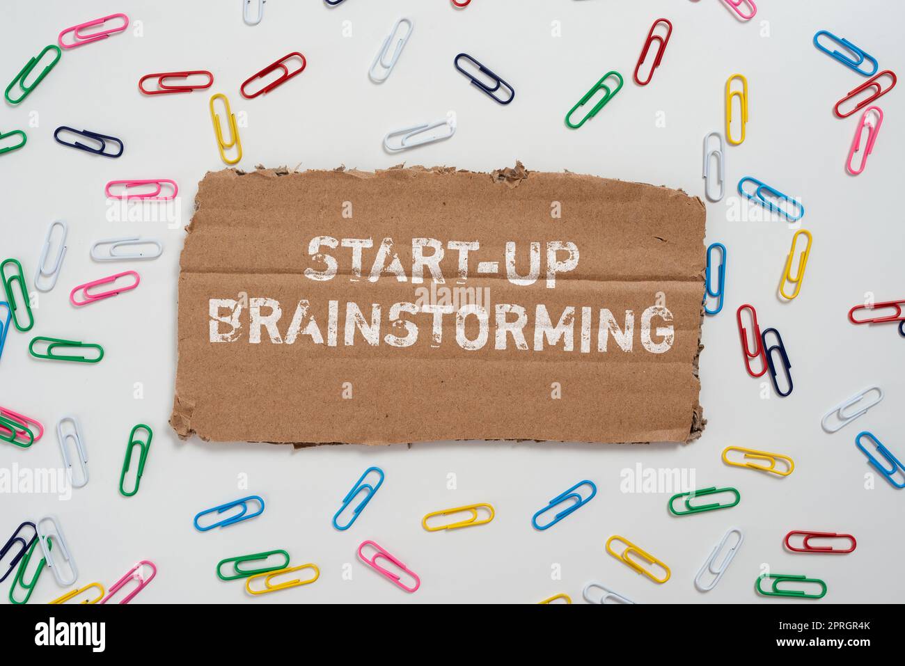 Hand writing sign Start Up Brainstorming. Word for Team work for making ...