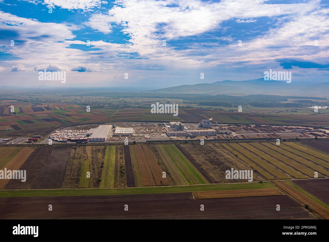 Processing lumber modern factory above top drone view Stock Photo - Alamy