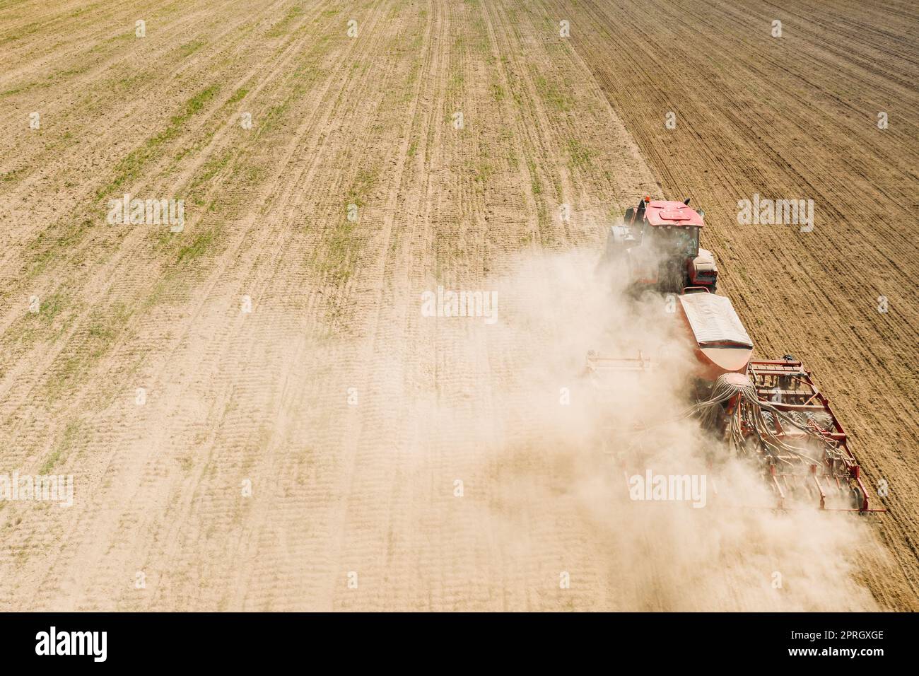Aerial View. Tractor With Seed Drill Machine Sowing The Seeds For Crops ...