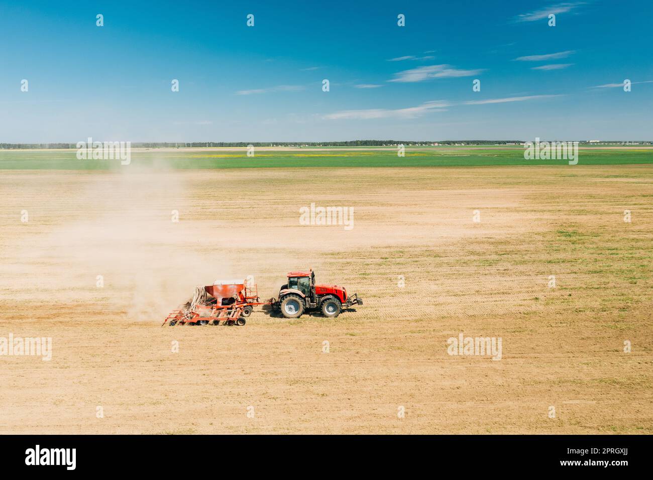 Aerial View. Tractor With Seed Drill Machine Sowing The Seeds For Crops ...