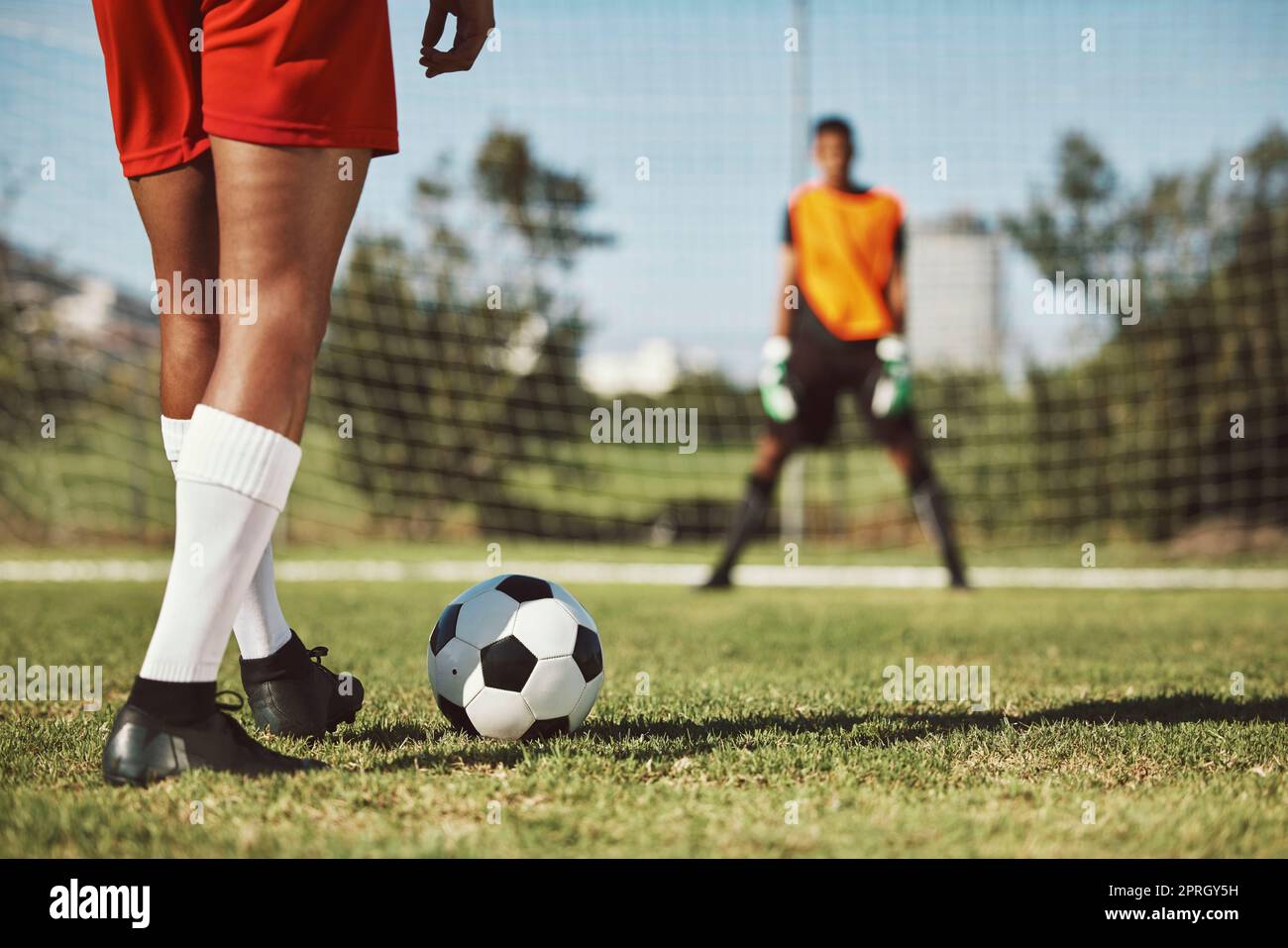 Sports, soccer field and legs of athlete with goalkeeper ready for ...