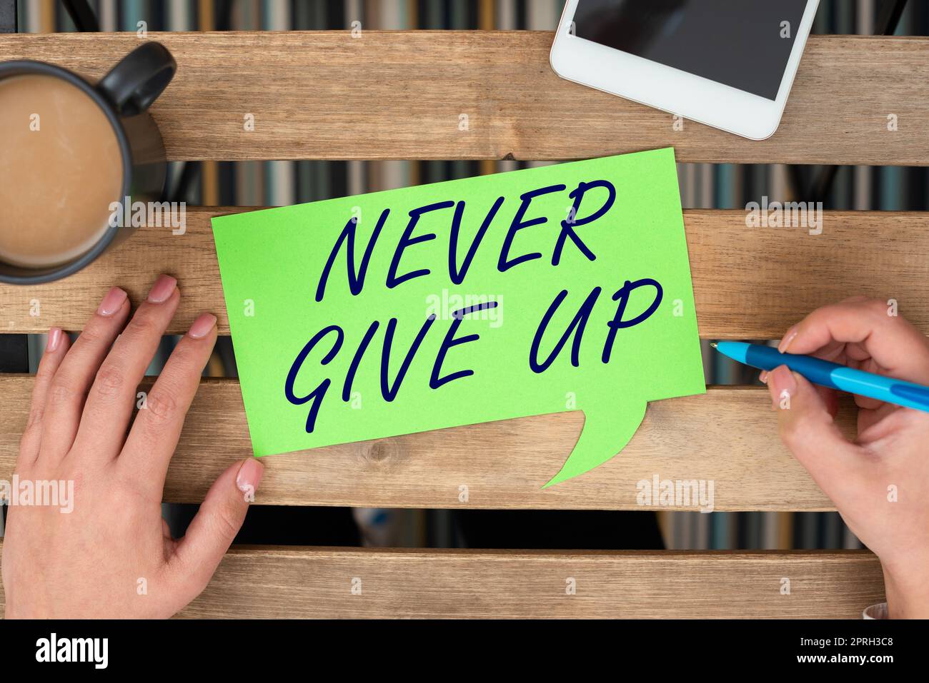 Sign displaying Never Give Up. Concept meaning Keep trying until you ...