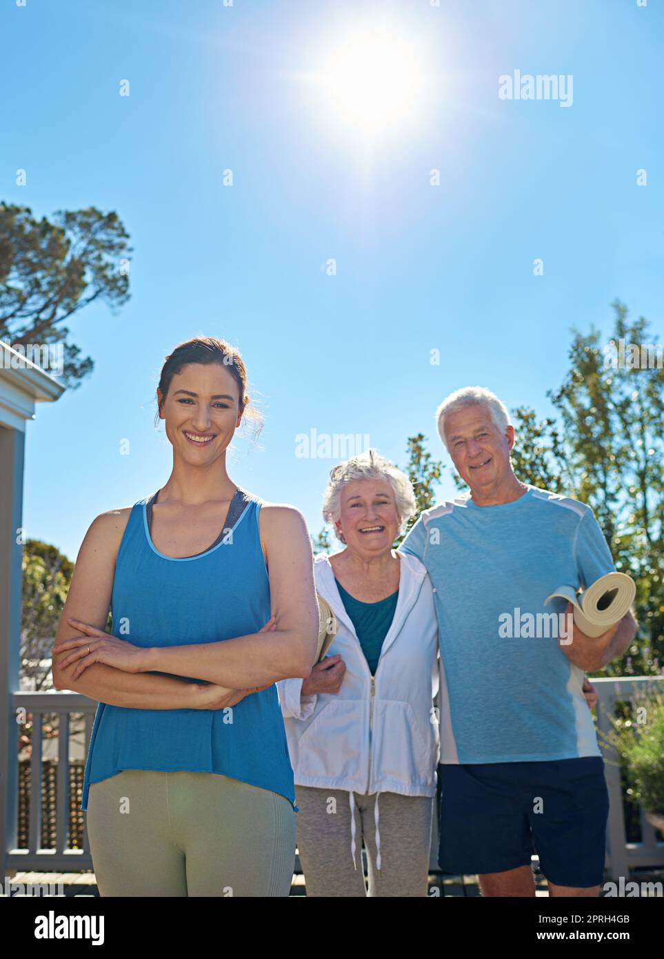She keeps seniors fit and healthy. Portrait of a senior couple standing ...