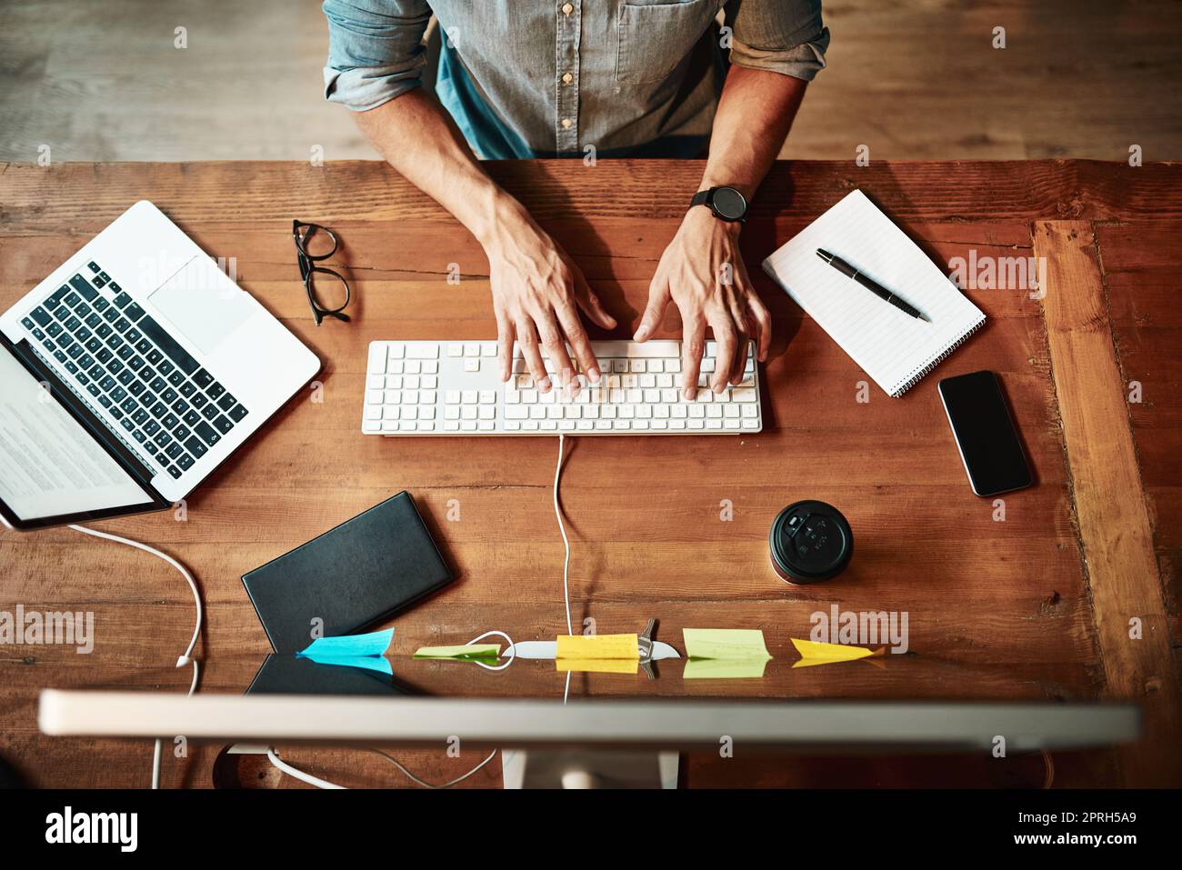 Where productivity happens. Cropped high angle shot of a businessman ...