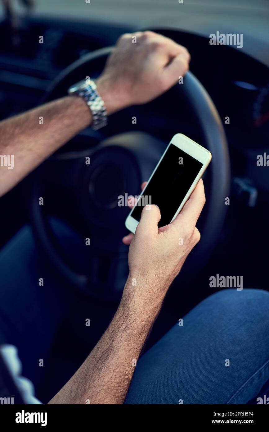Where is this place. a unrecognizable man using his phone while driving ...