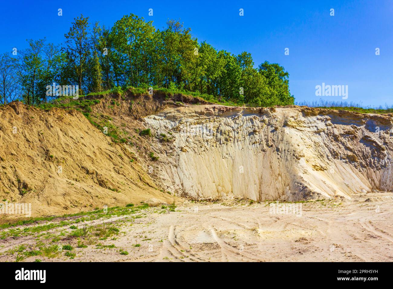 Excavated sand mountains and rubble piles quarry lake dredging pond ...