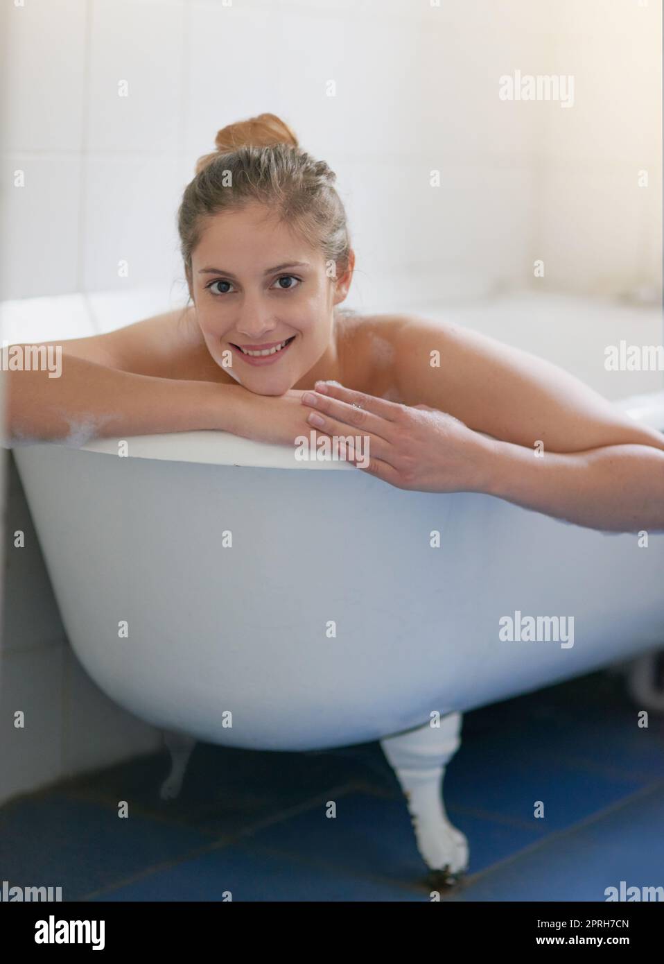 Happiness is a long, hot bubble bath. Portrait of a beautiful young ...