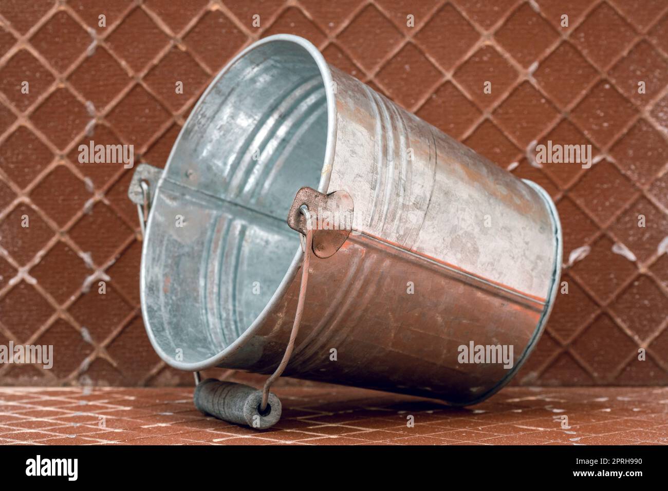 Metal bucket on the reverse side of the ceramic tile.Home improvement ...