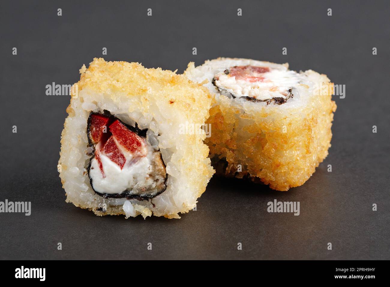 Fried rolls with pepper, eel and cheese Stock Photo - Alamy