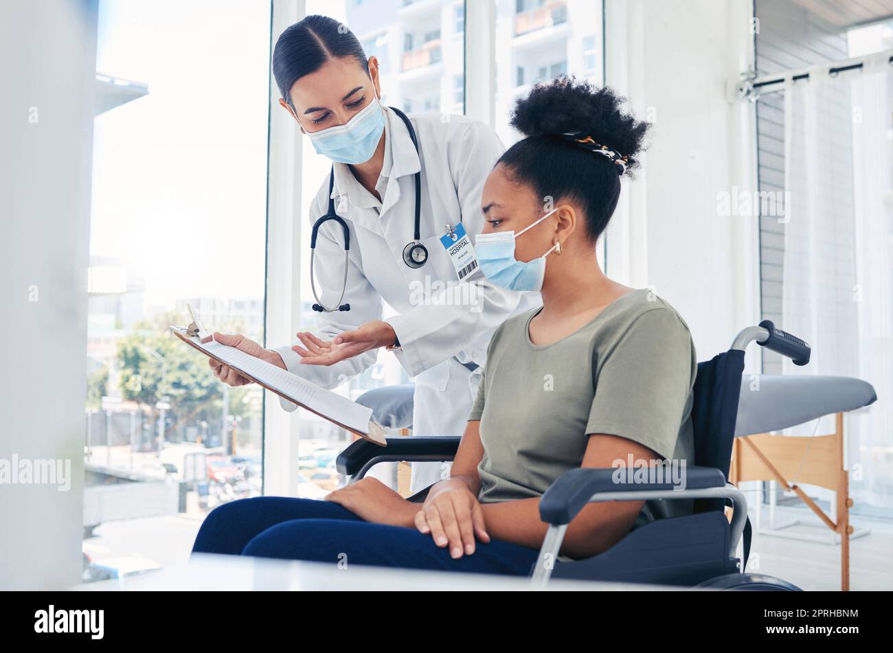 Doctor with covid patient in wheelchair for insurance, healthcare ...