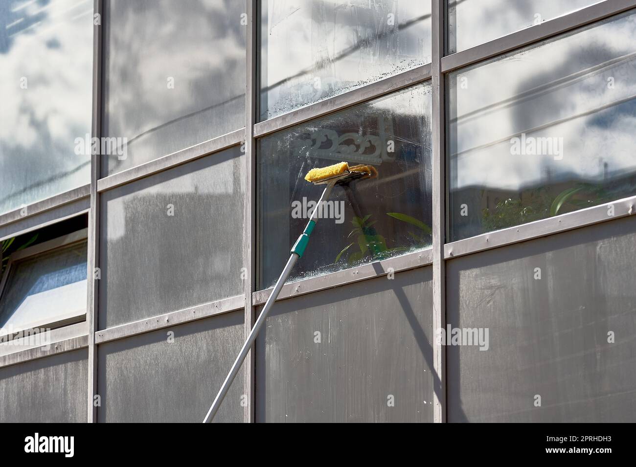 window washing, washing a street shop window Stock Photo - Alamy