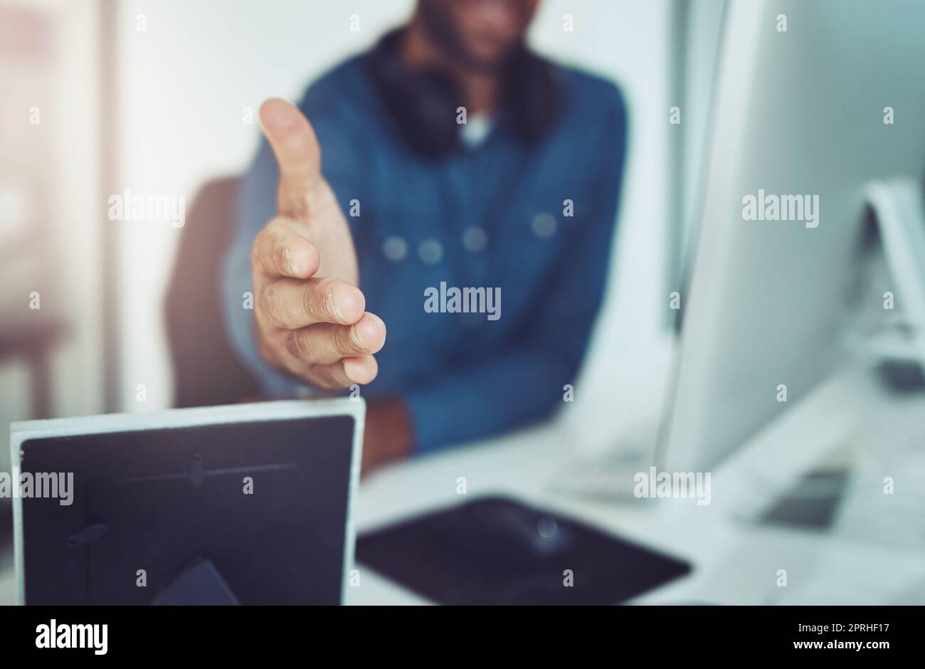 Welcome to the team. an unrecognizable young businessman reaching out ...