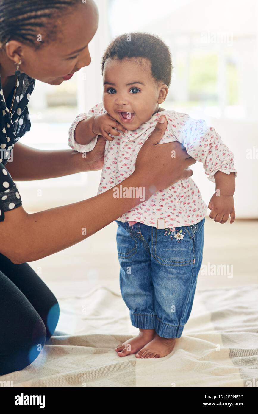 Baby is standing hi-res stock photography and images - Alamy