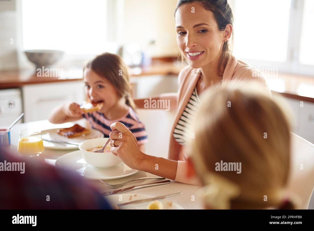 Having fun at the breakfast table. a family having breakfast together ...