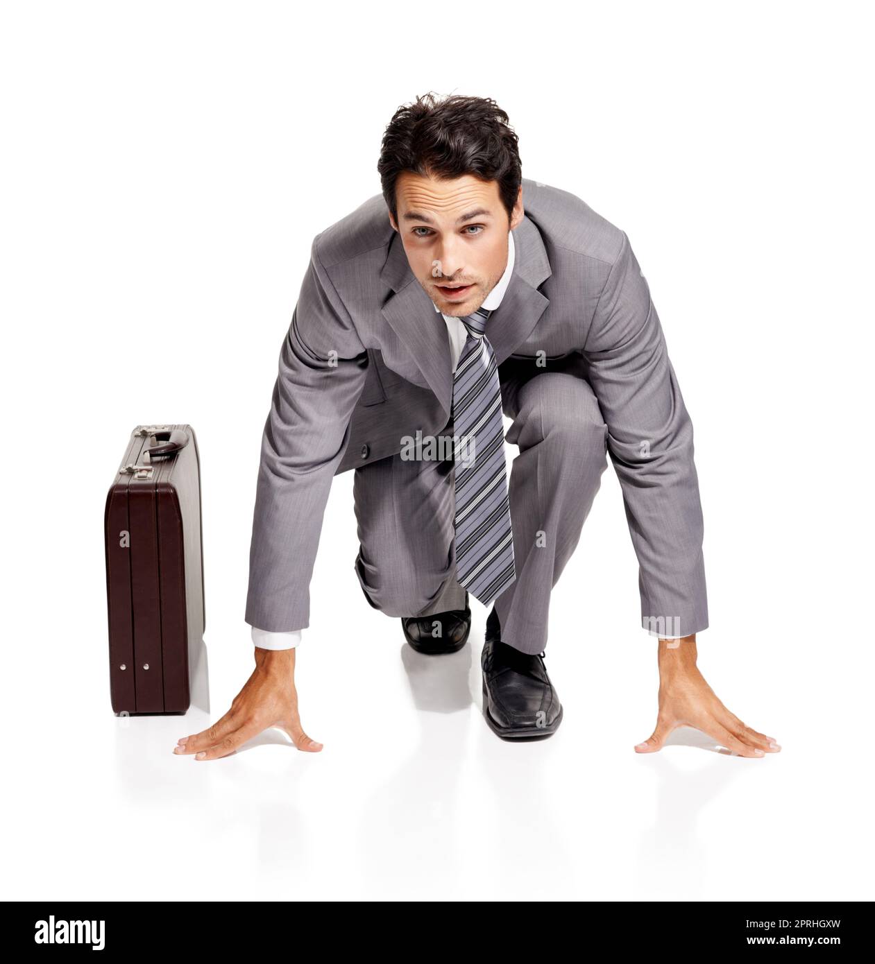 Ive gotto be ahead of the pack. A young businessman crouching in the ...